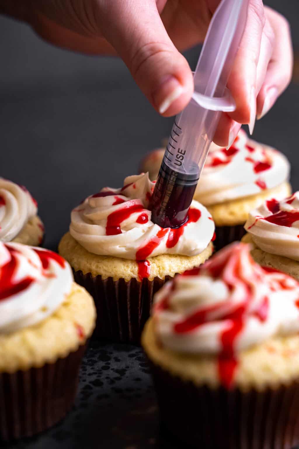 Bloody Vanilla Cupcakes with Edible "Blood" - The Chunky Chef